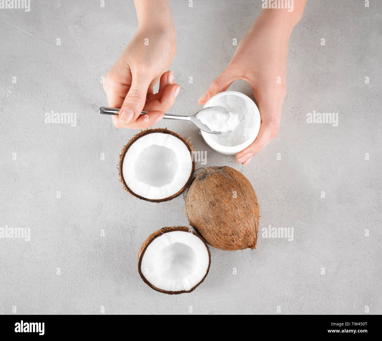 Woman coconut oil cook hi-res stock photography and images - Alamy