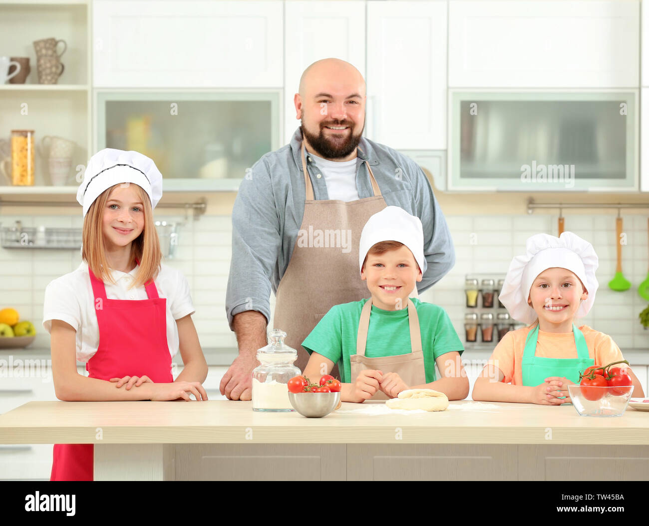 Group of children and teacher in kitchen during cooking classes Stock ...