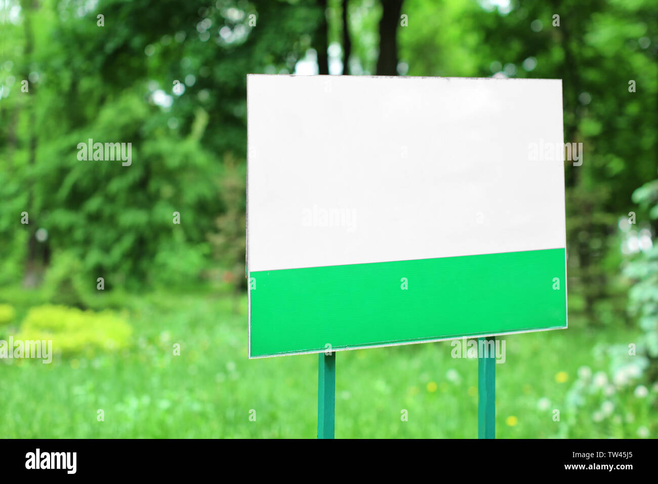 Empty sign board in park Stock Photo - Alamy