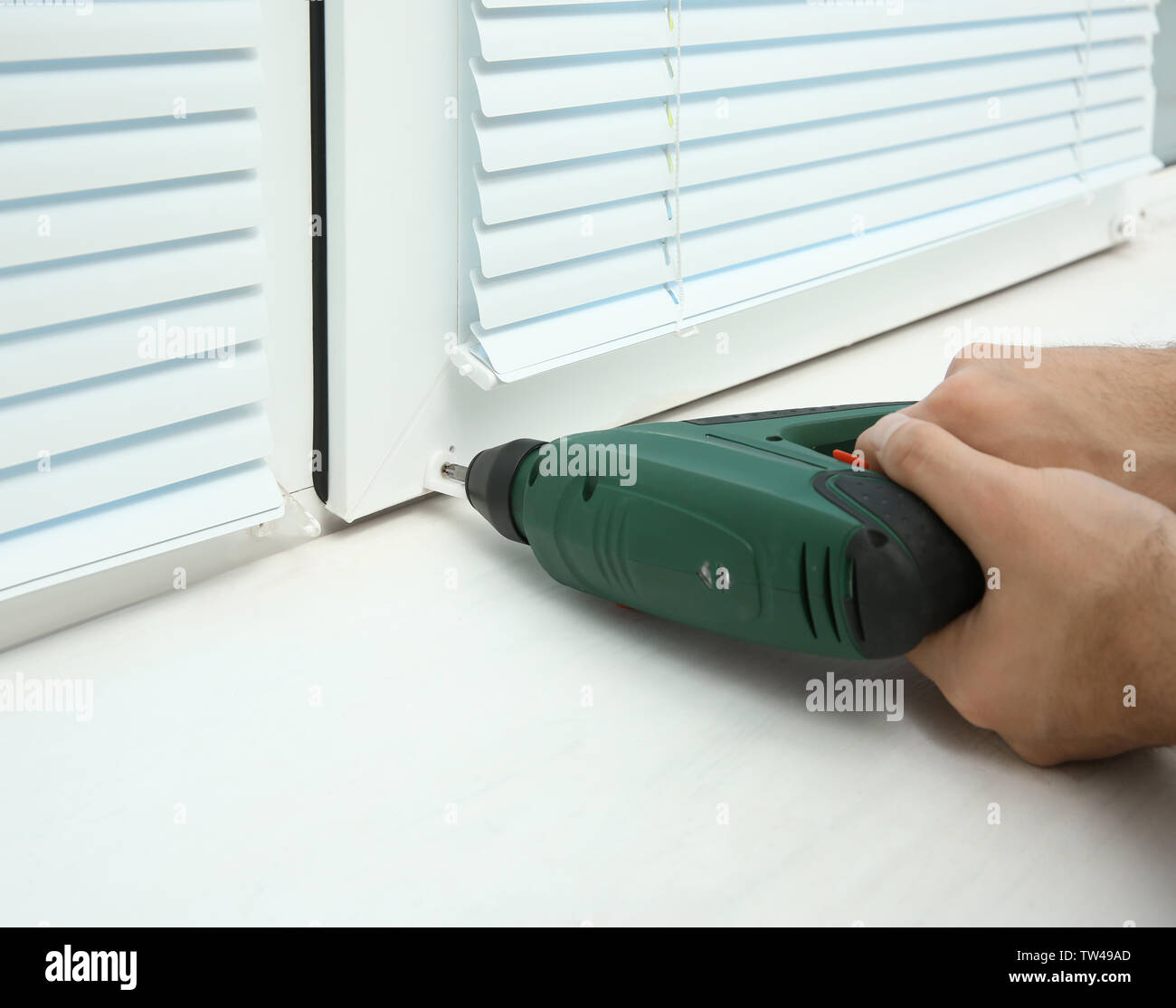Installing window sill man hi-res stock photography and images - Alamy