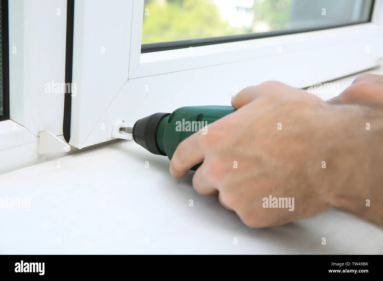 Installing window sill man hi-res stock photography and images - Alamy