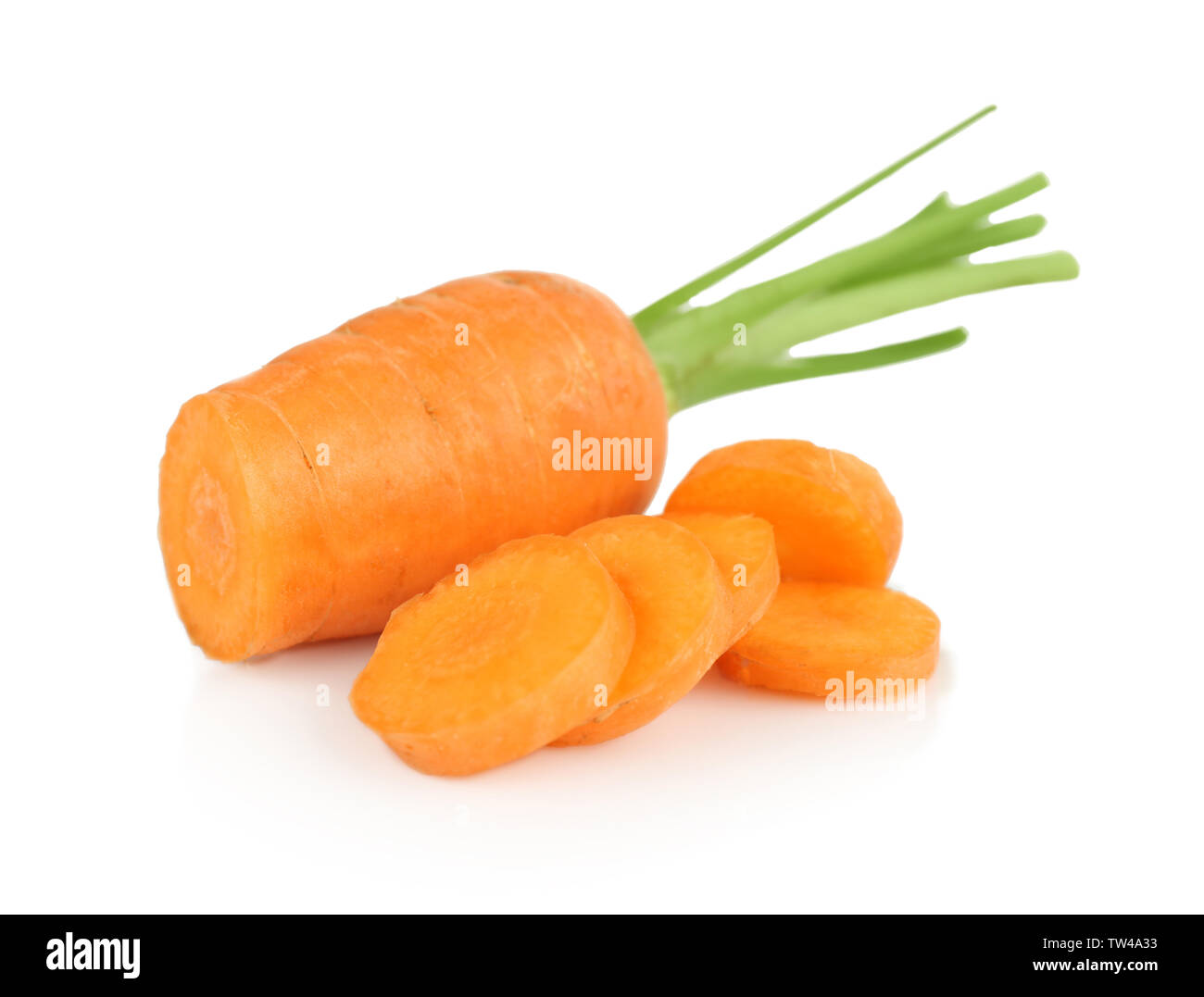 Fresh carrot with slices on white background Stock Photo - Alamy