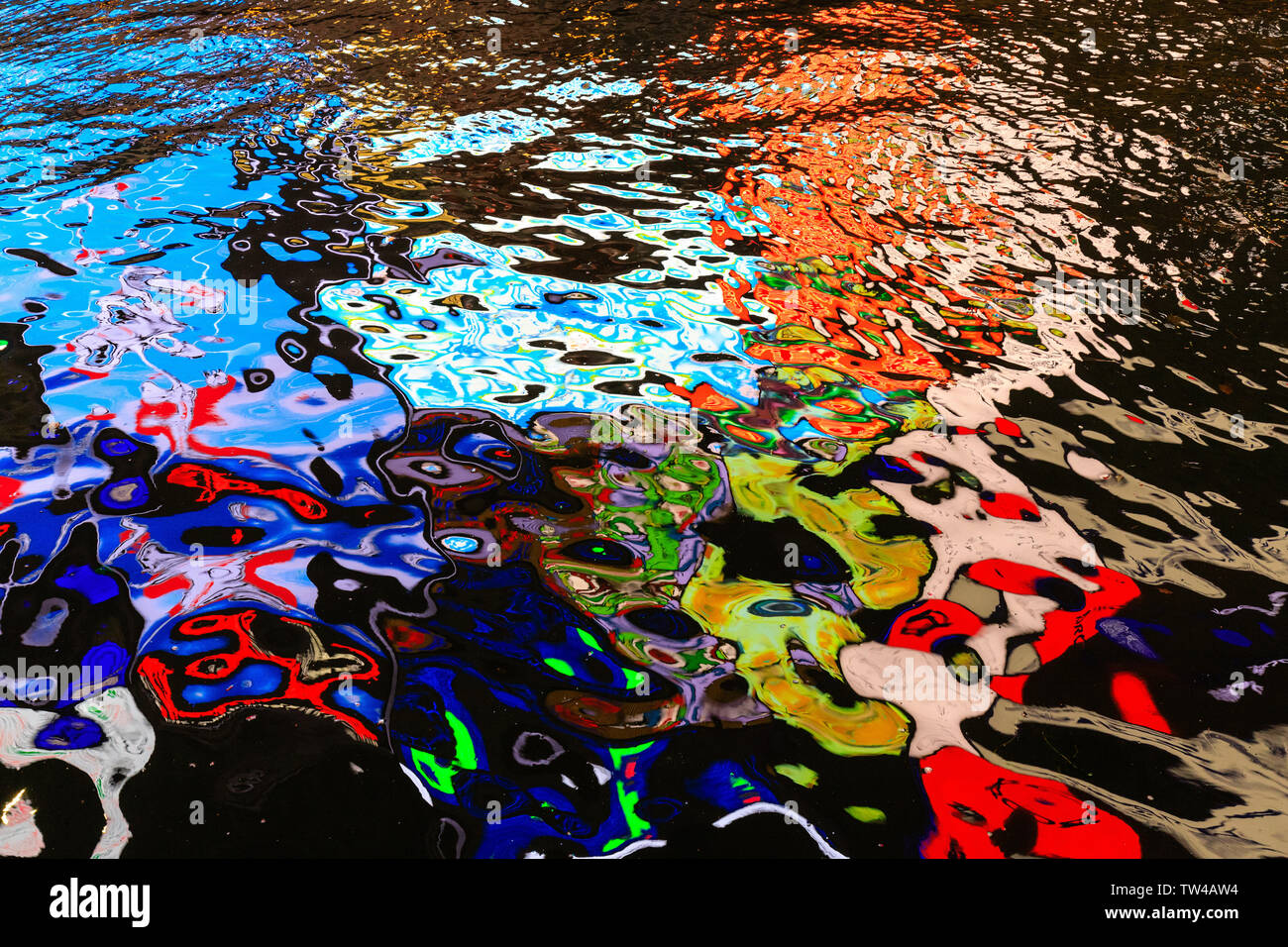 Colorful neon shop signs reflection on water Stock Photo - Alamy