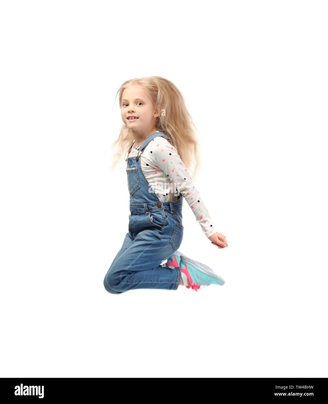 Cute jumping girl on white background Stock Photo - Alamy