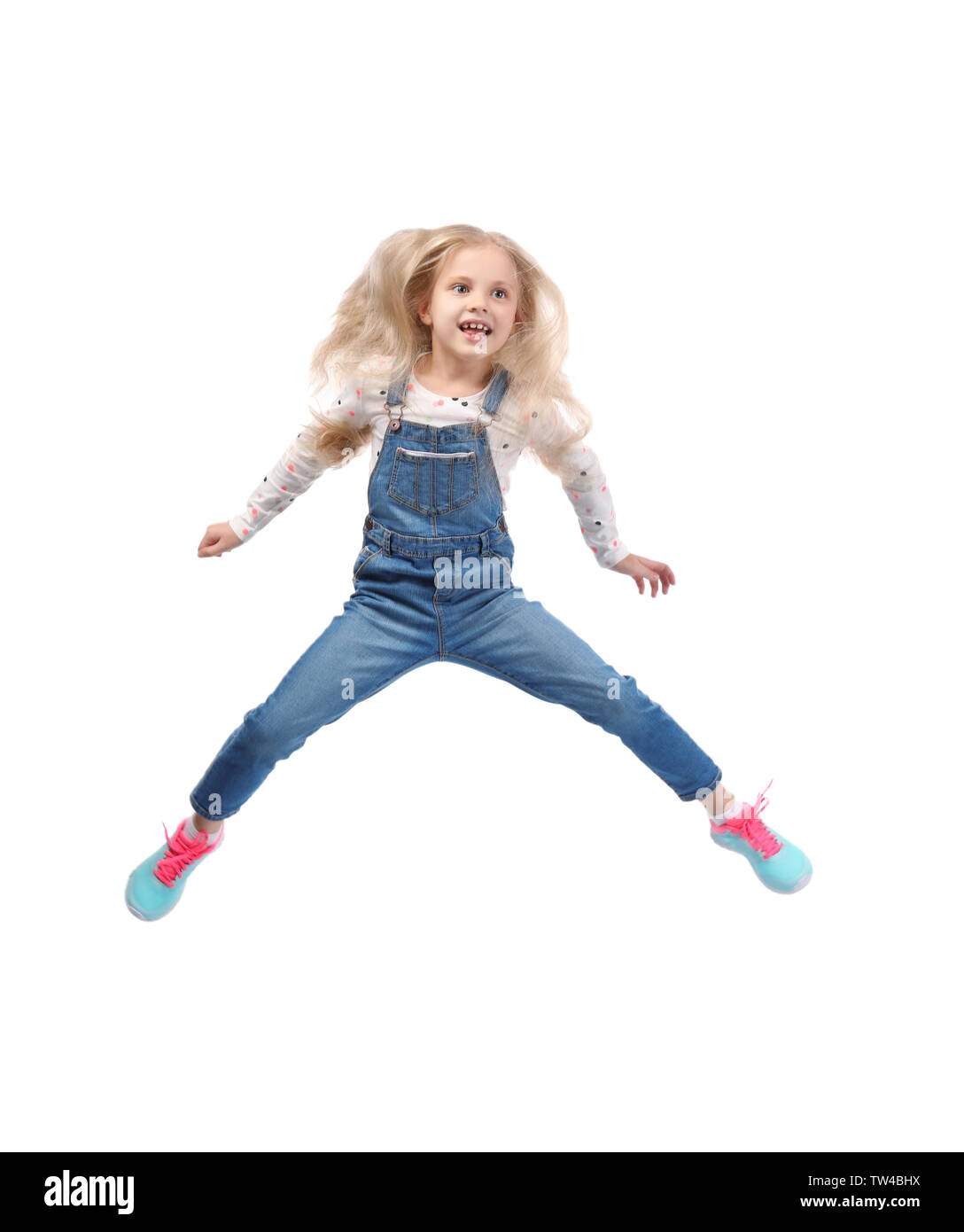 Cute jumping girl on white background Stock Photo - Alamy