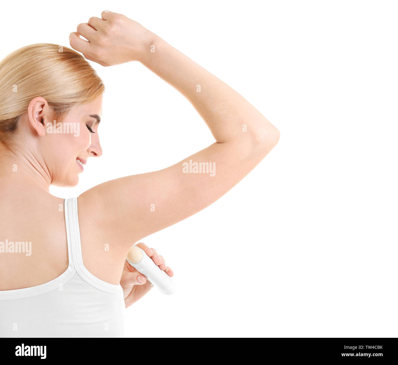 Beautiful young woman using deodorant on white background Stock Photo ...
