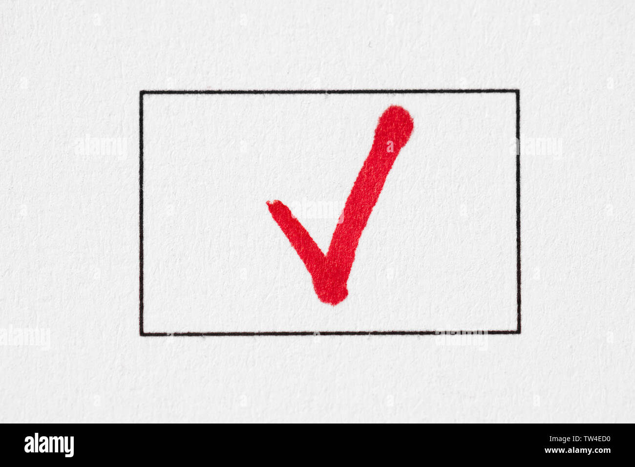 Red check mark drawn with marker on paper, macro photo Stock Photo - Alamy