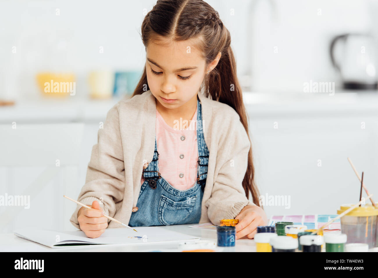 Child focused on drawing hi-res stock photography and images - Alamy