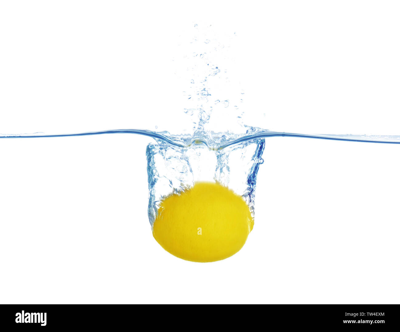 Falling lemon into water on white background Stock Photo - Alamy