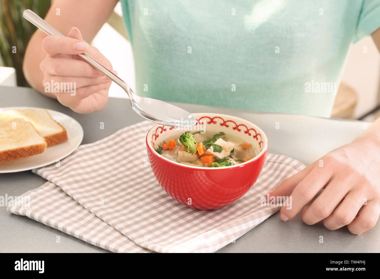 Person eating soup meat table hi-res stock photography and images - Alamy
