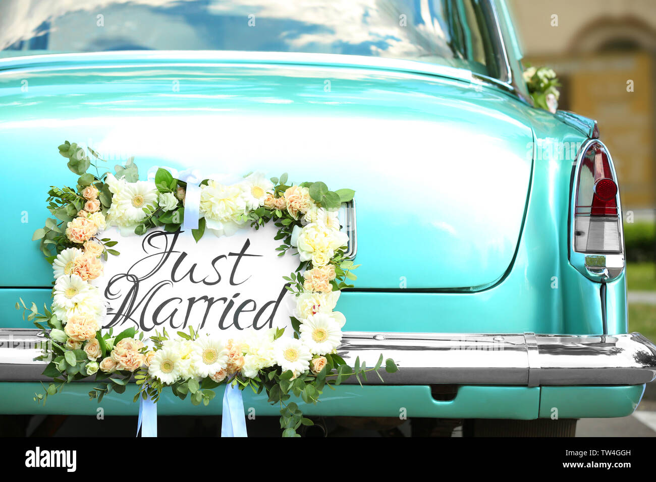 Beautiful wedding car with plate JUST MARRIED outdoors Stock Photo - Alamy