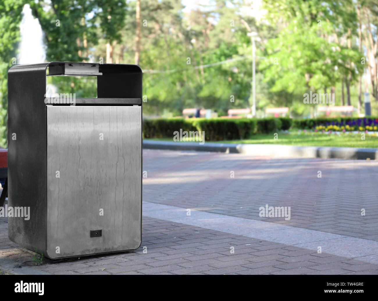 Modern garbage bin outdoors Stock Photo - Alamy