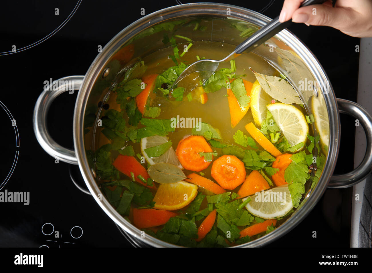 Woman preparing brine for turkey in cooking pot Stock Photo - Alamy