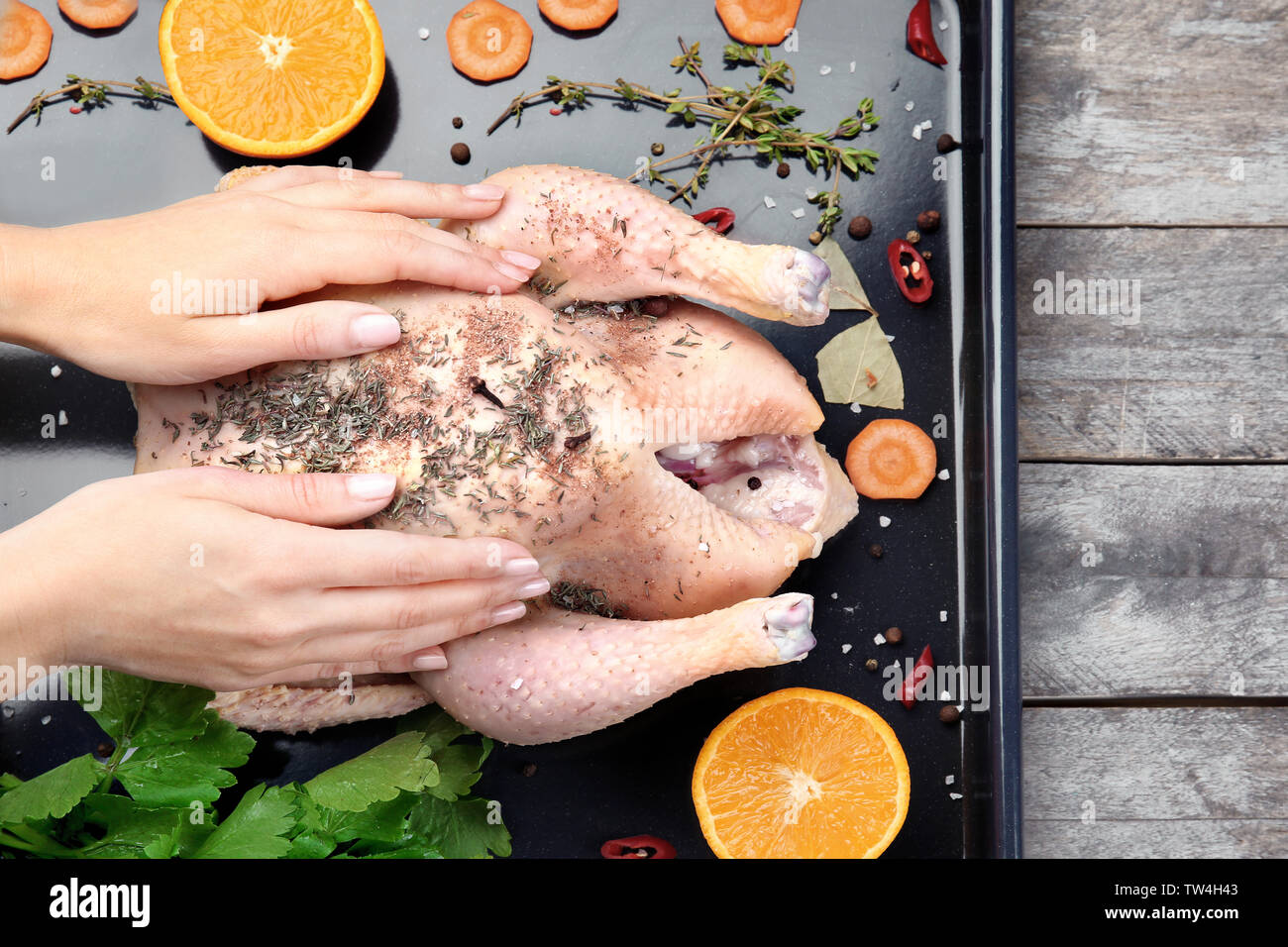 Woman cooking turkey herbs hi-res stock photography and images - Alamy