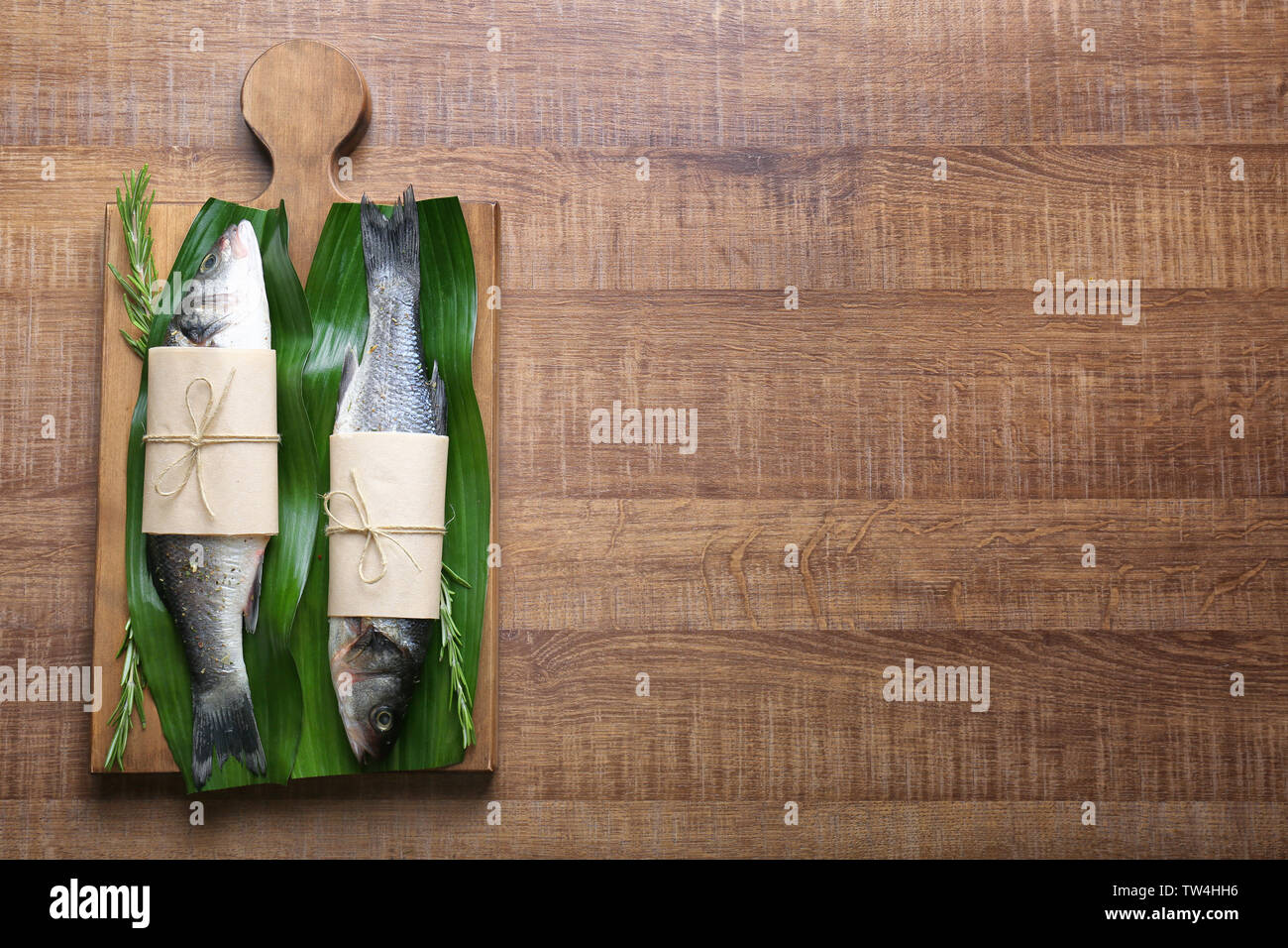 Whole fish wrapped in paper hi-res stock photography and images - Alamy