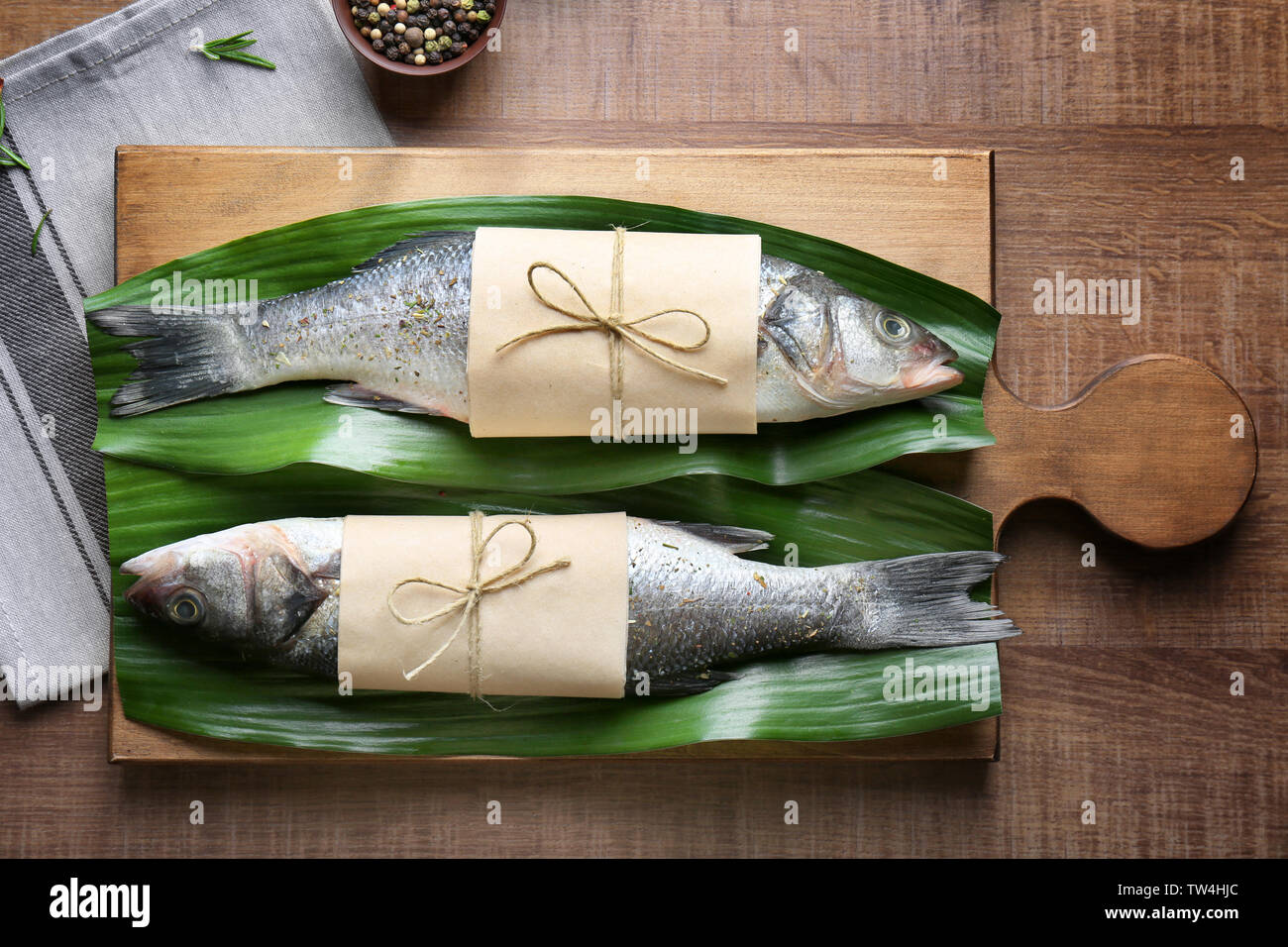 Whole fish wrapped in paper hi-res stock photography and images - Alamy