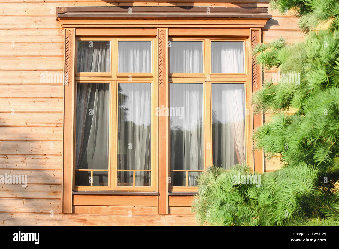 Exterior of building with beautiful wooden windows on sunny day Stock ...