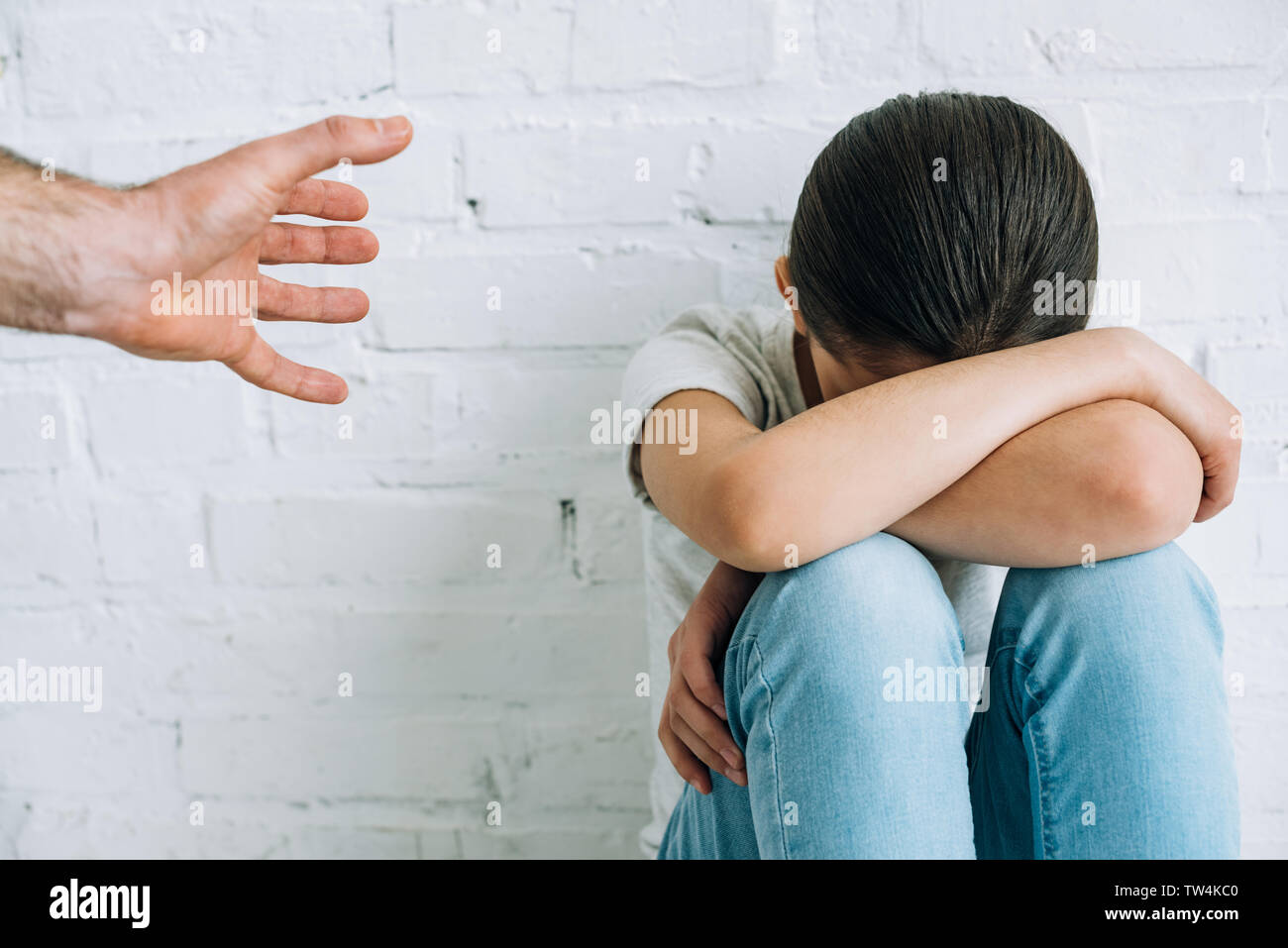 partial view of abusive father and sad daughter at home Stock Photo - Alamy