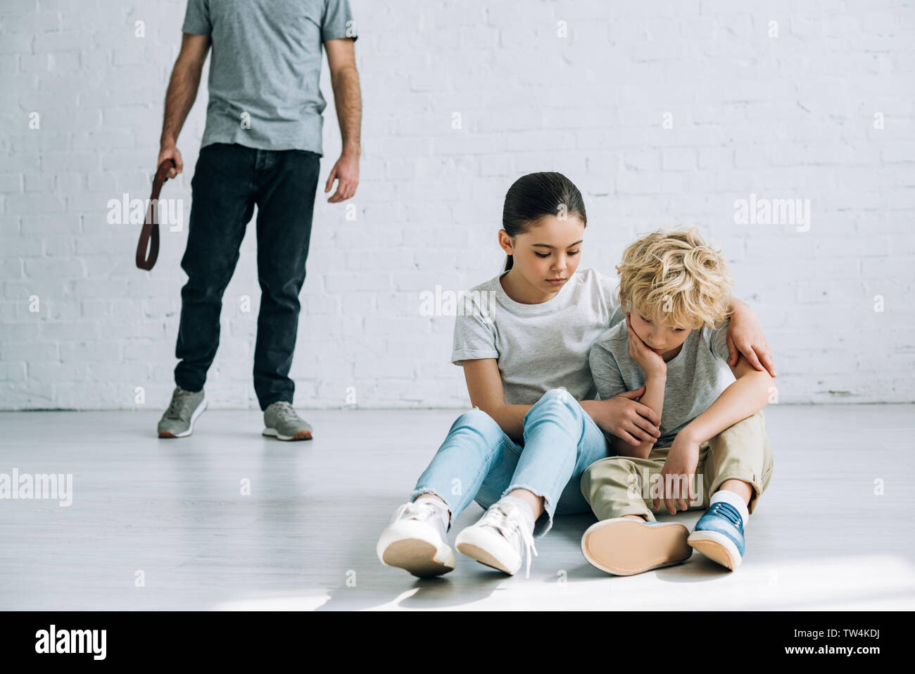 Children embracing sad hi-res stock photography and images - Alamy