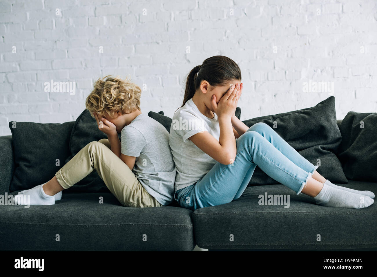 Two sad sister sitting on hi-res stock photography and images - Alamy