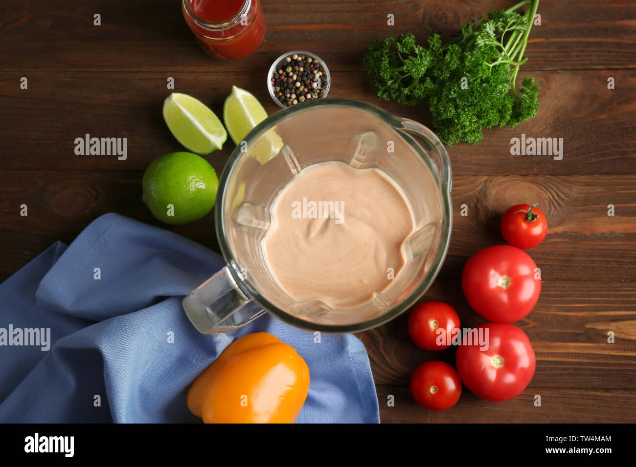 Tasty creamy tomato sauce for fish taco in blender on kitchen table ...