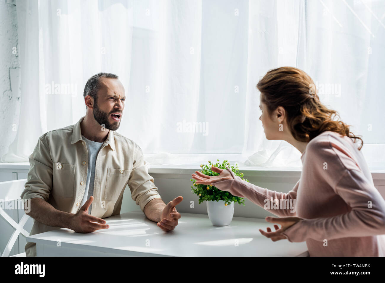 Frustrated angry man yelling sitting hi-res stock photography and ...