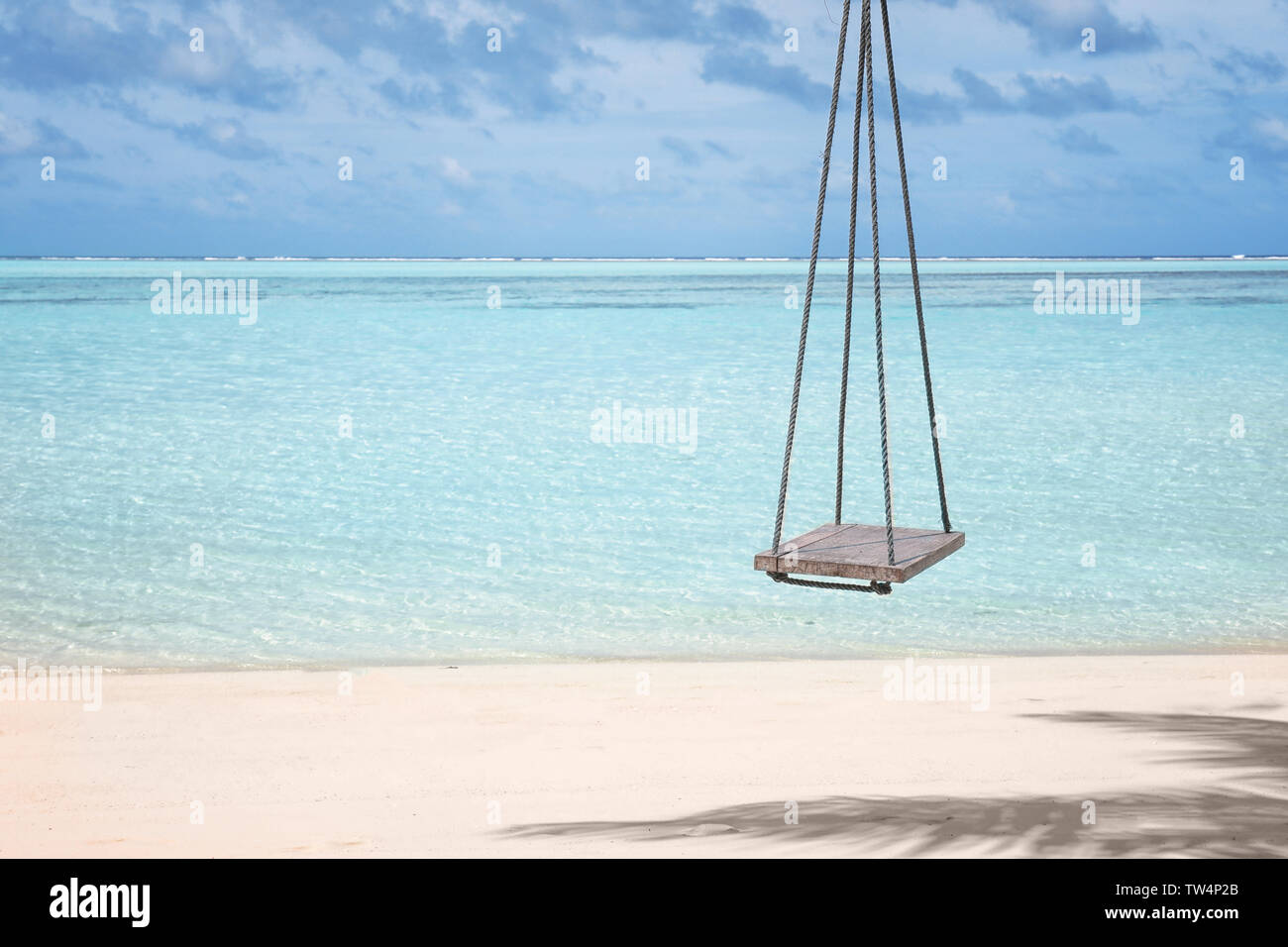 Swings on beach at sea resort Stock Photo - Alamy