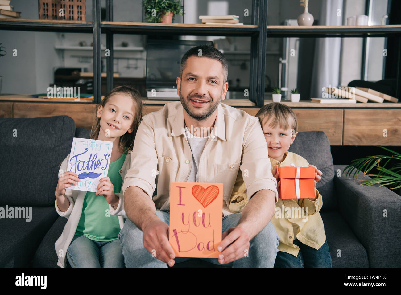 happy father holding greeting card with i love you dad inscription and ...