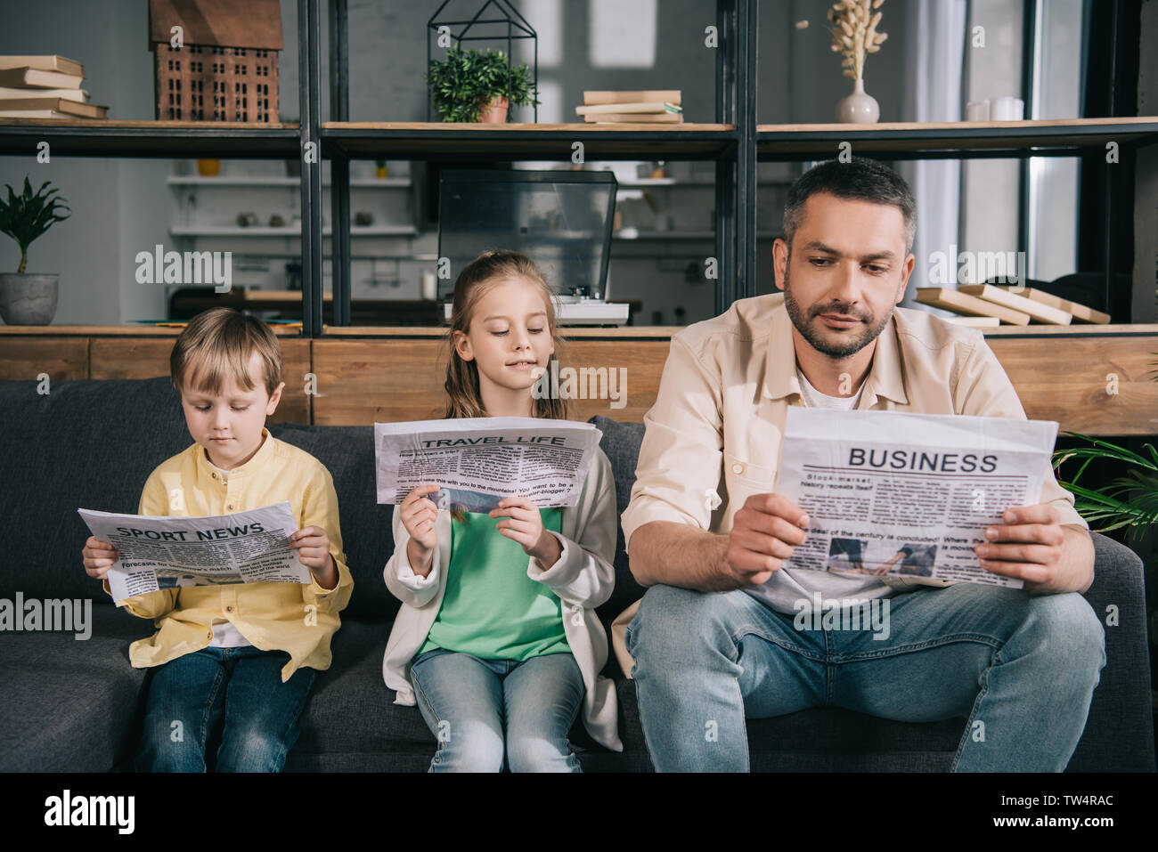 Boy father reading newspapers hi-res stock photography and images - Alamy