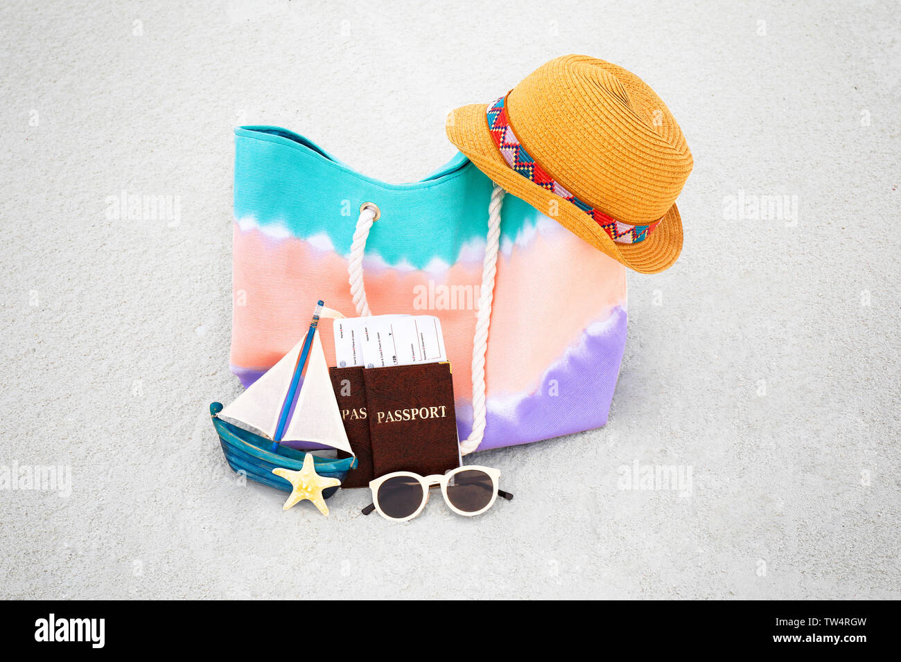 Passports And Tickets With Beach Accessories On Sand Summer Vacation