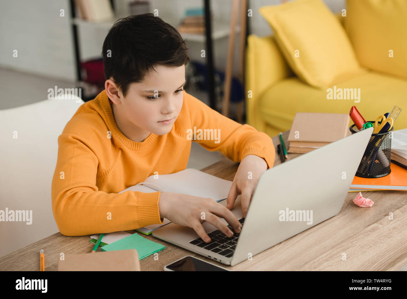 Attentive schoolboy using digital hi-res stock photography and images ...