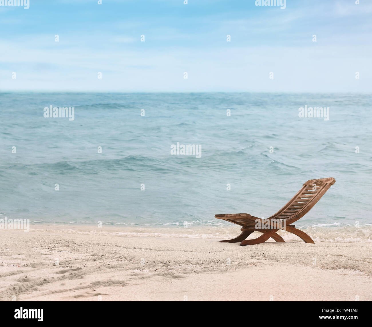 Beach chair on sea shore at resort Stock Photo - Alamy