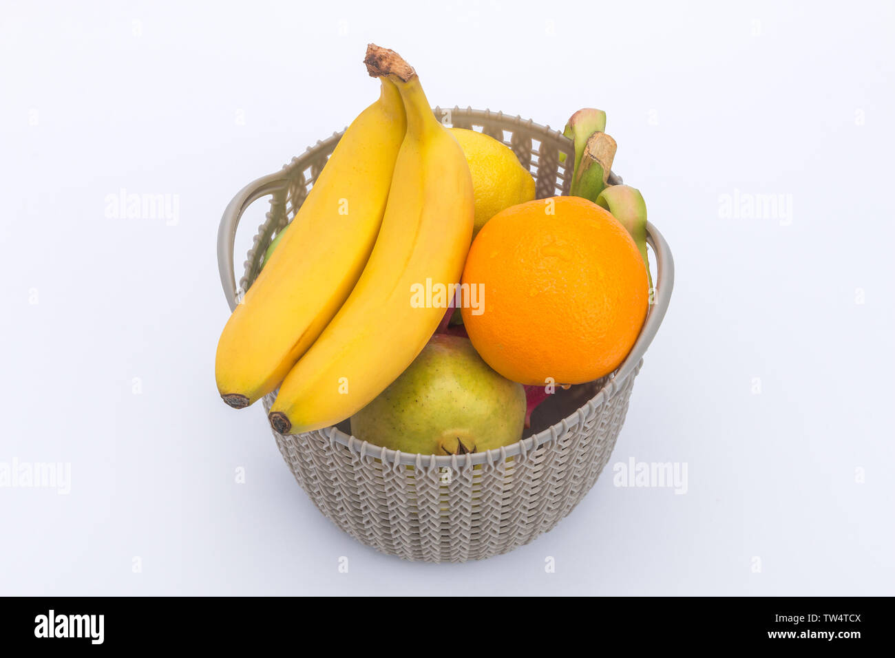 Fruits in the fruit basket Stock Photo - Alamy