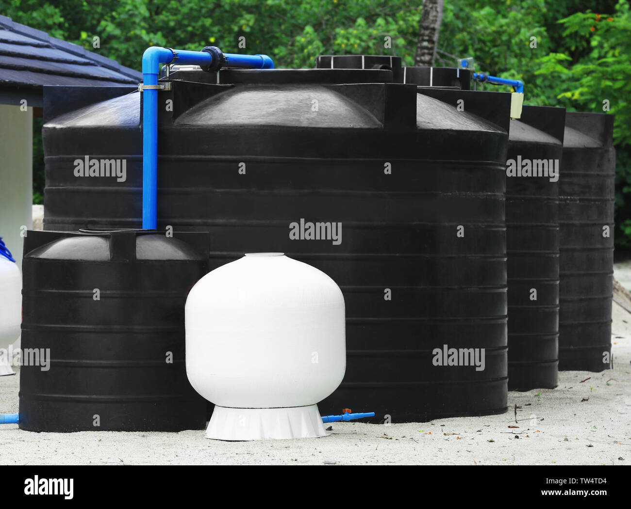 Tanks for water storage at resort Stock Photo - Alamy