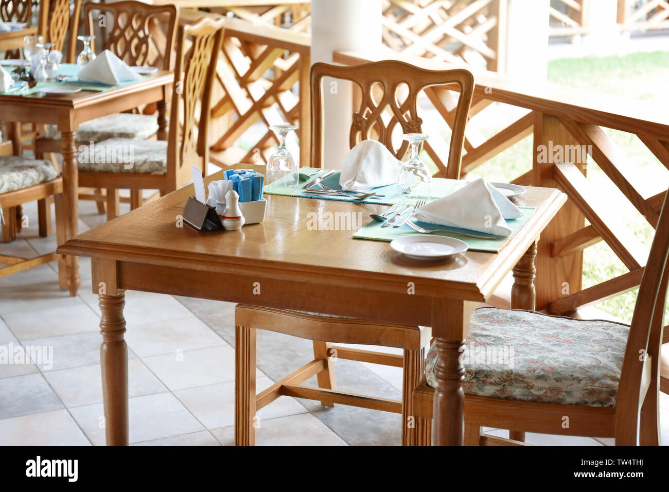 Table set in modern cafe at resort Stock Photo - Alamy