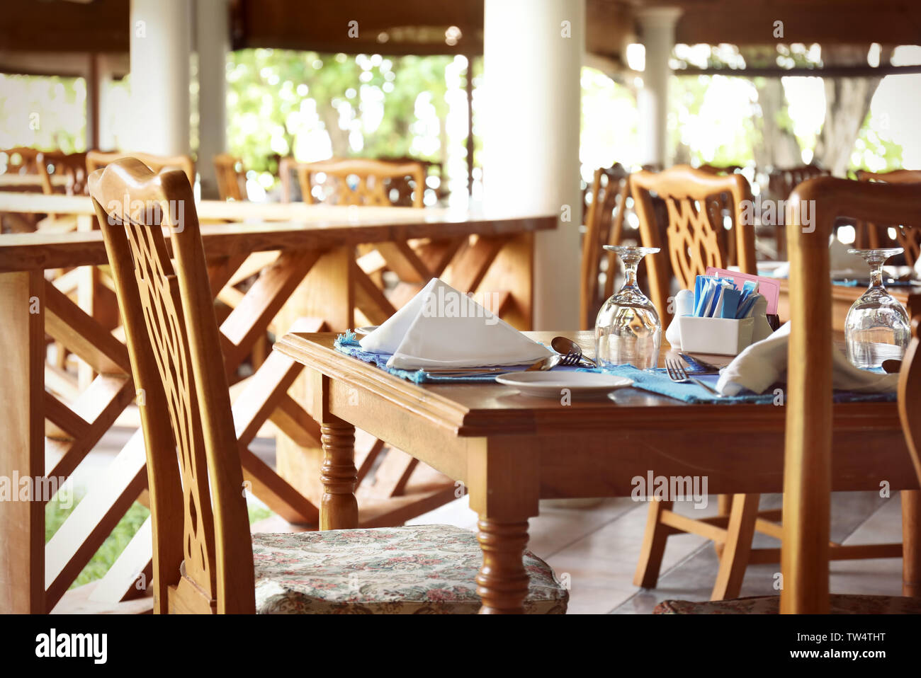 Table set in modern cafe at resort Stock Photo - Alamy