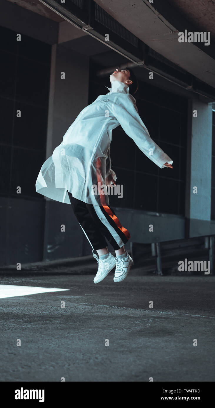 Post apocalypse female survivor - A woman in a medical gown in an ...