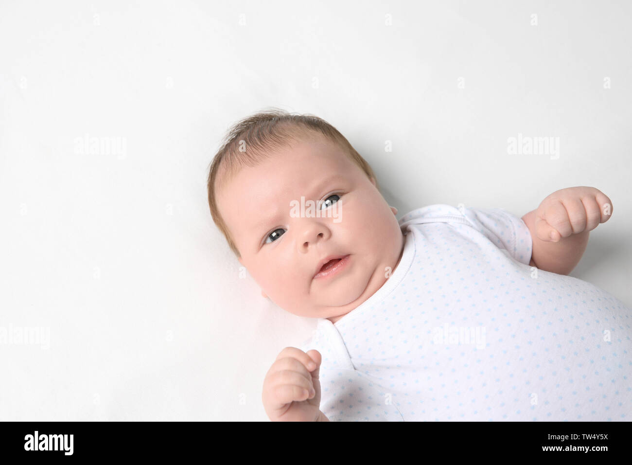 Cute newborn baby on white background Stock Photo - Alamy
