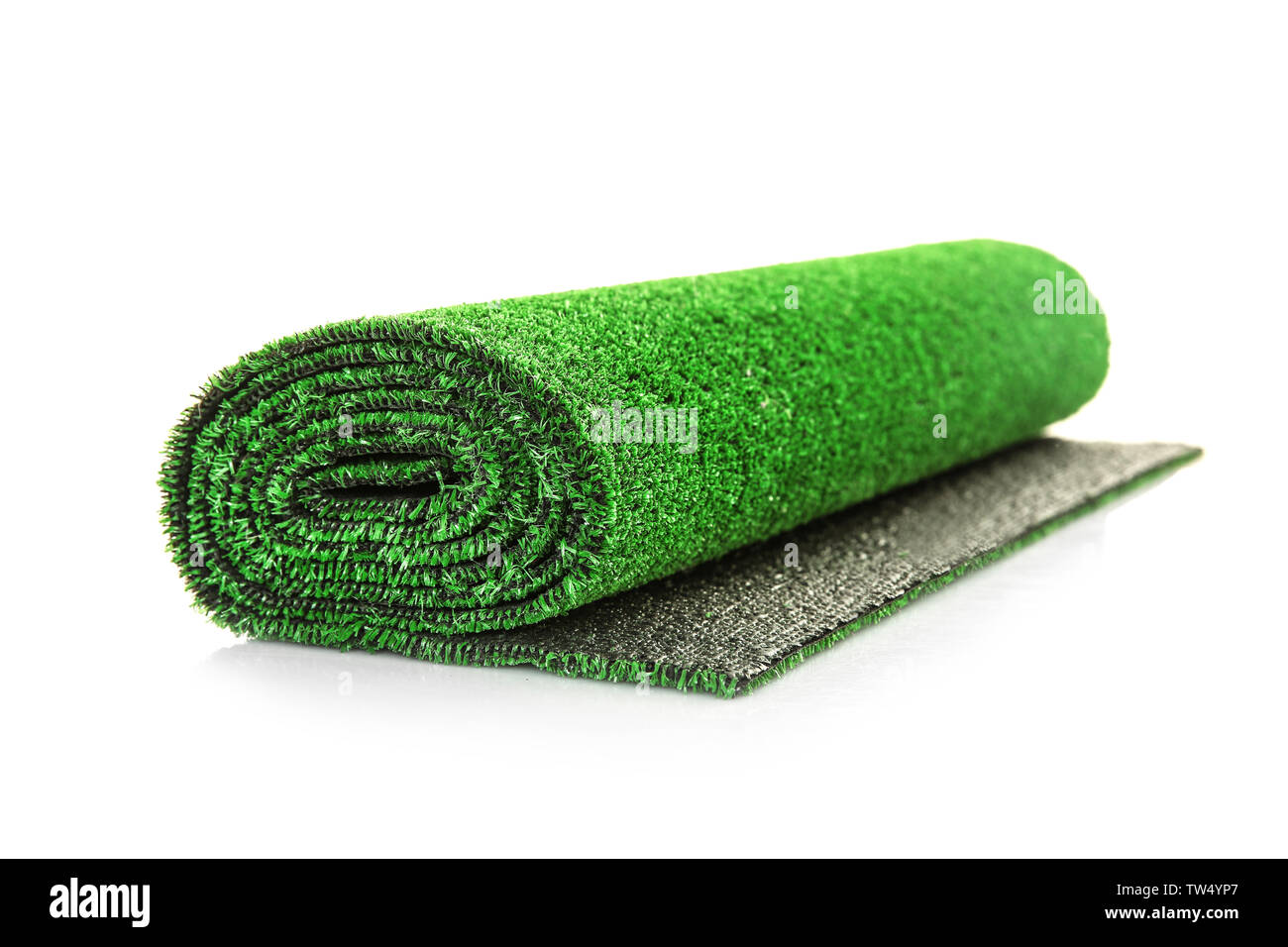 Roll of artificial grass mat on white background Stock Photo - Alamy