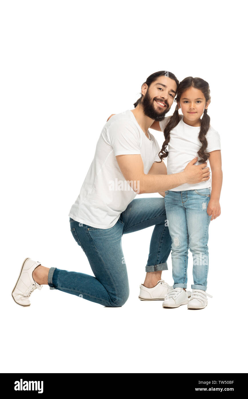 happy latin father smiling while hugging cute daughter isolated on ...