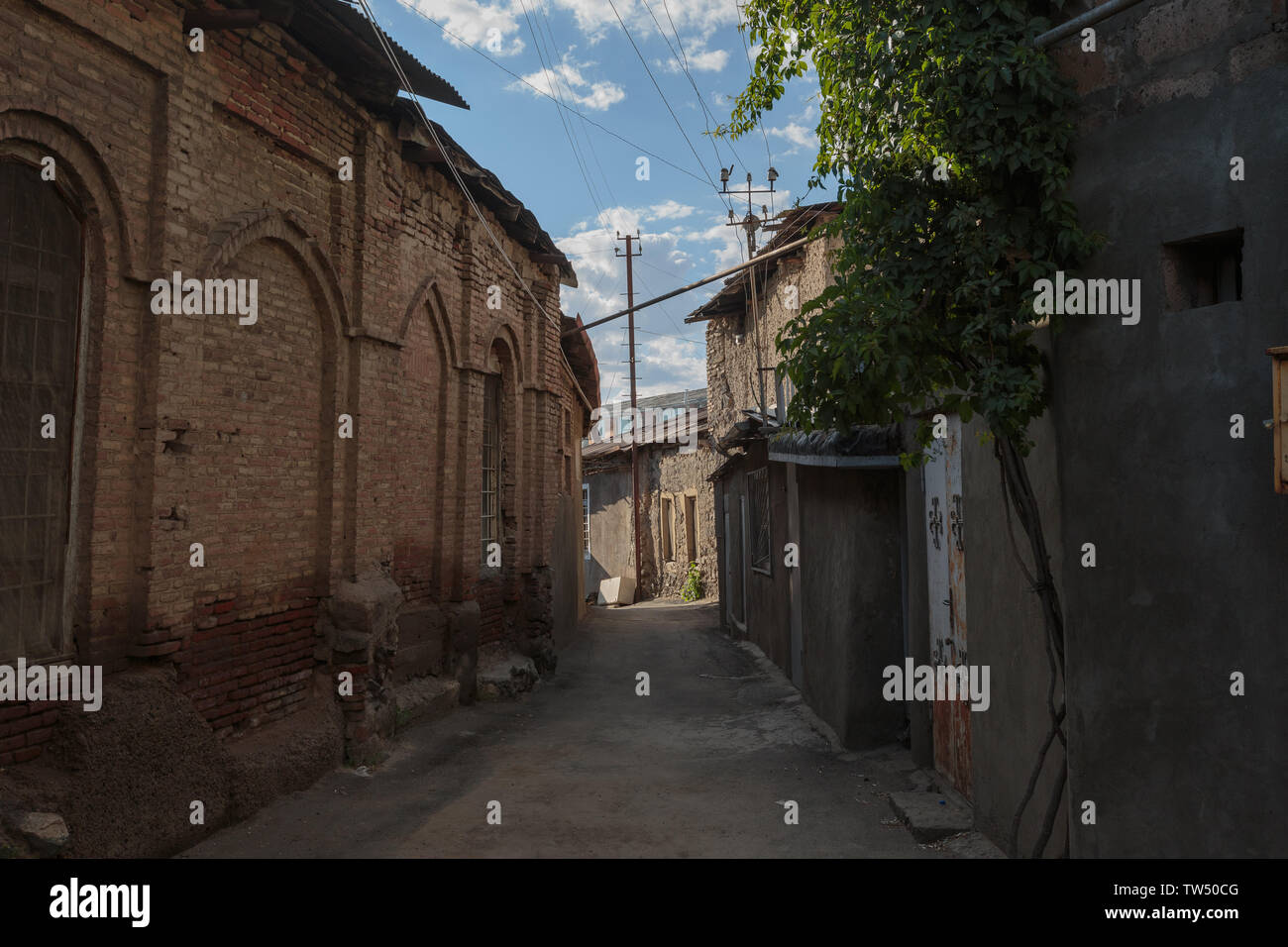 lane between stone houses in the daytime Stock Photo - Alamy