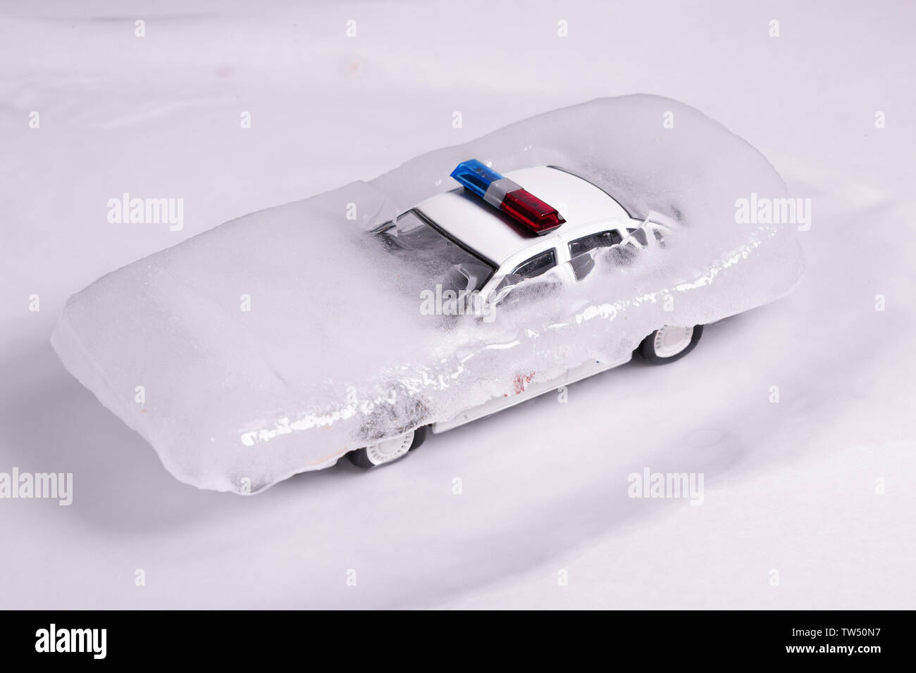 toy police car thawing from ice. frozen police car Stock Photo - Alamy