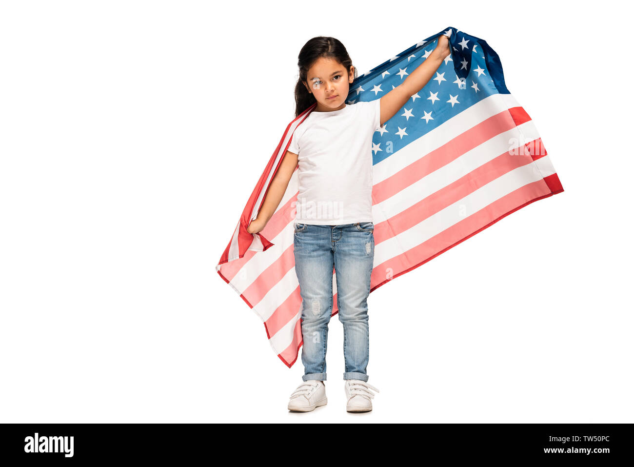 cute latin kid in denim jeans standing with american flag isolated on ...