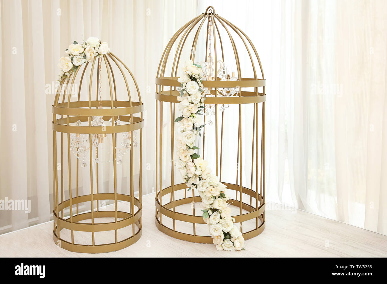 Decorative cages in wedding hall Stock Photo - Alamy