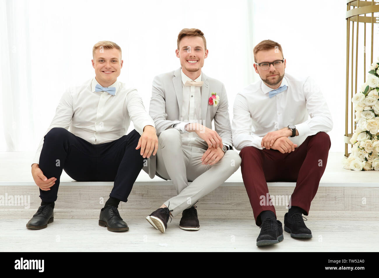 Happy handsome groom with best men on wedding day, indoors Stock Photo ...