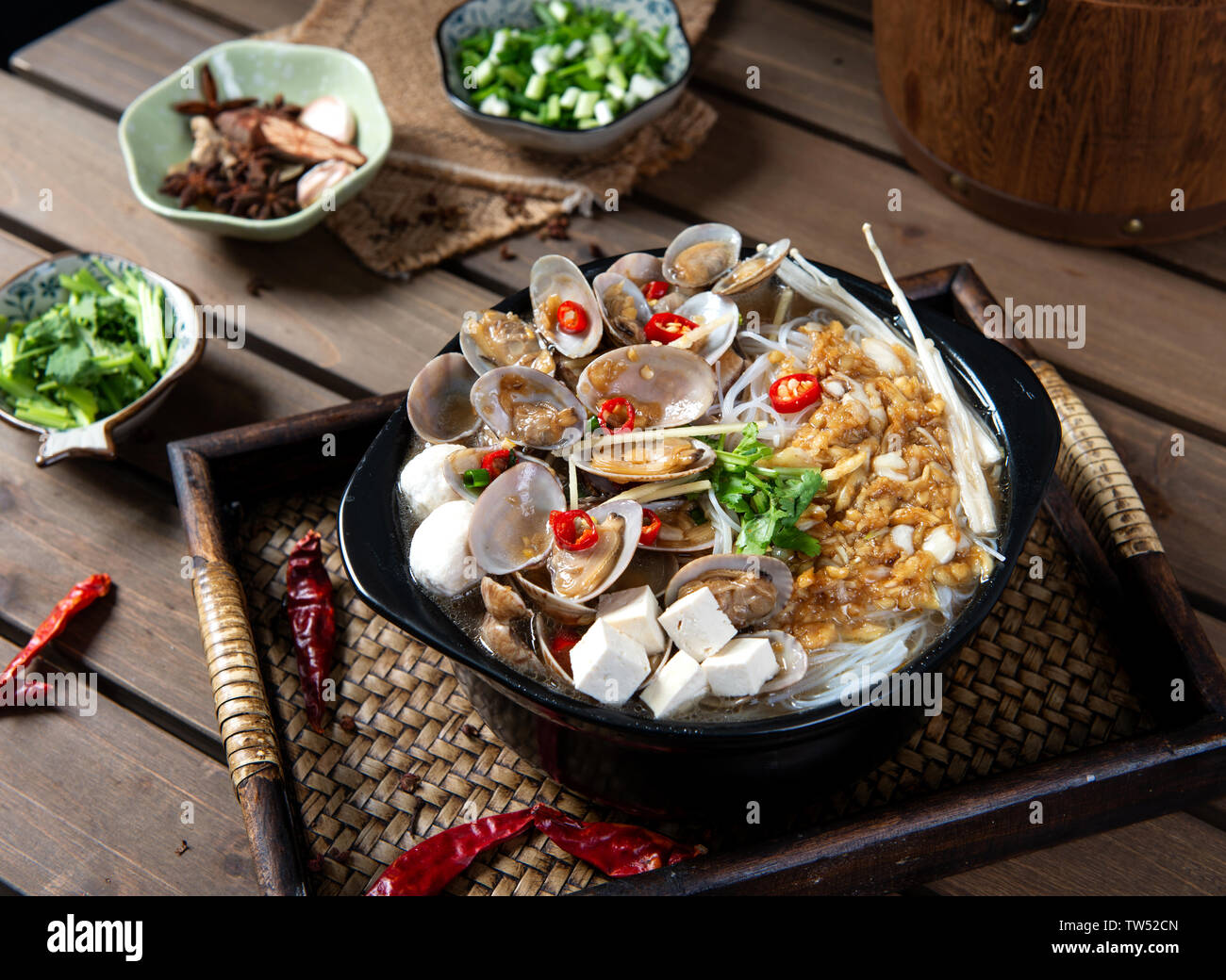 Golden soup, spicy flower armor, pink noodles Stock Photo - Alamy