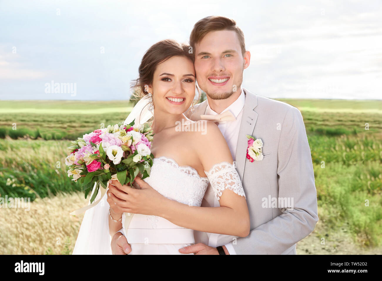 Happy beautiful couple on wedding day, outdoors Stock Photo - Alamy