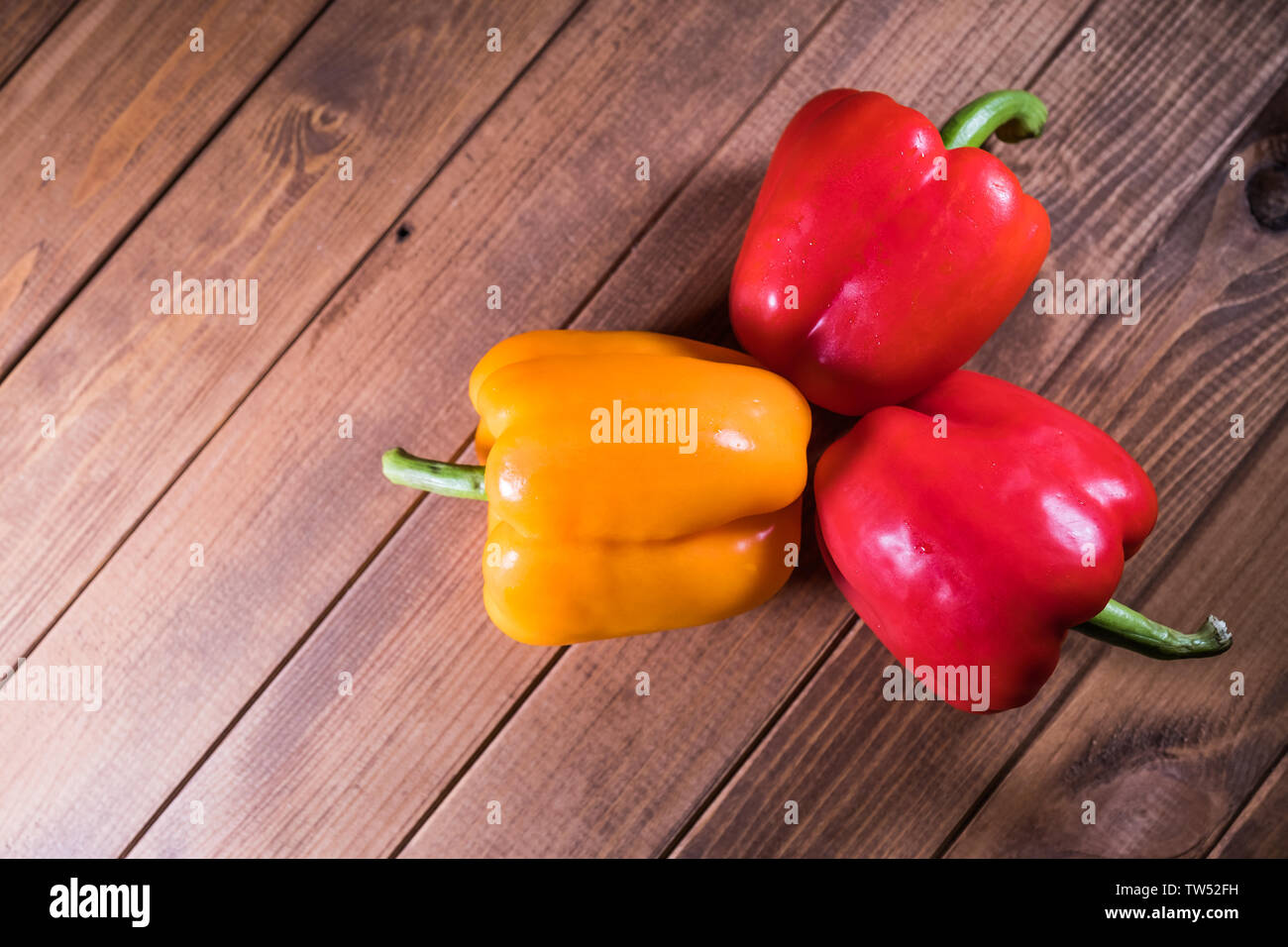 Colorful fresh paprika on a dark wooden table. Fresh vegetables Stock ...