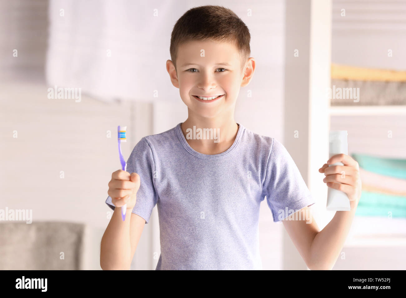 Cute little boy with toothbrush and paste at home. Cleaning teeth ...