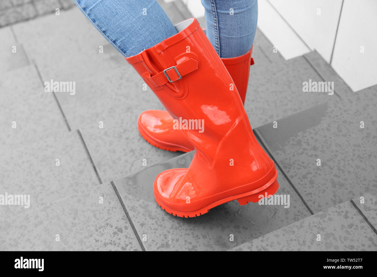 Woman wearing red rubber boots hi-res stock photography and images - Alamy